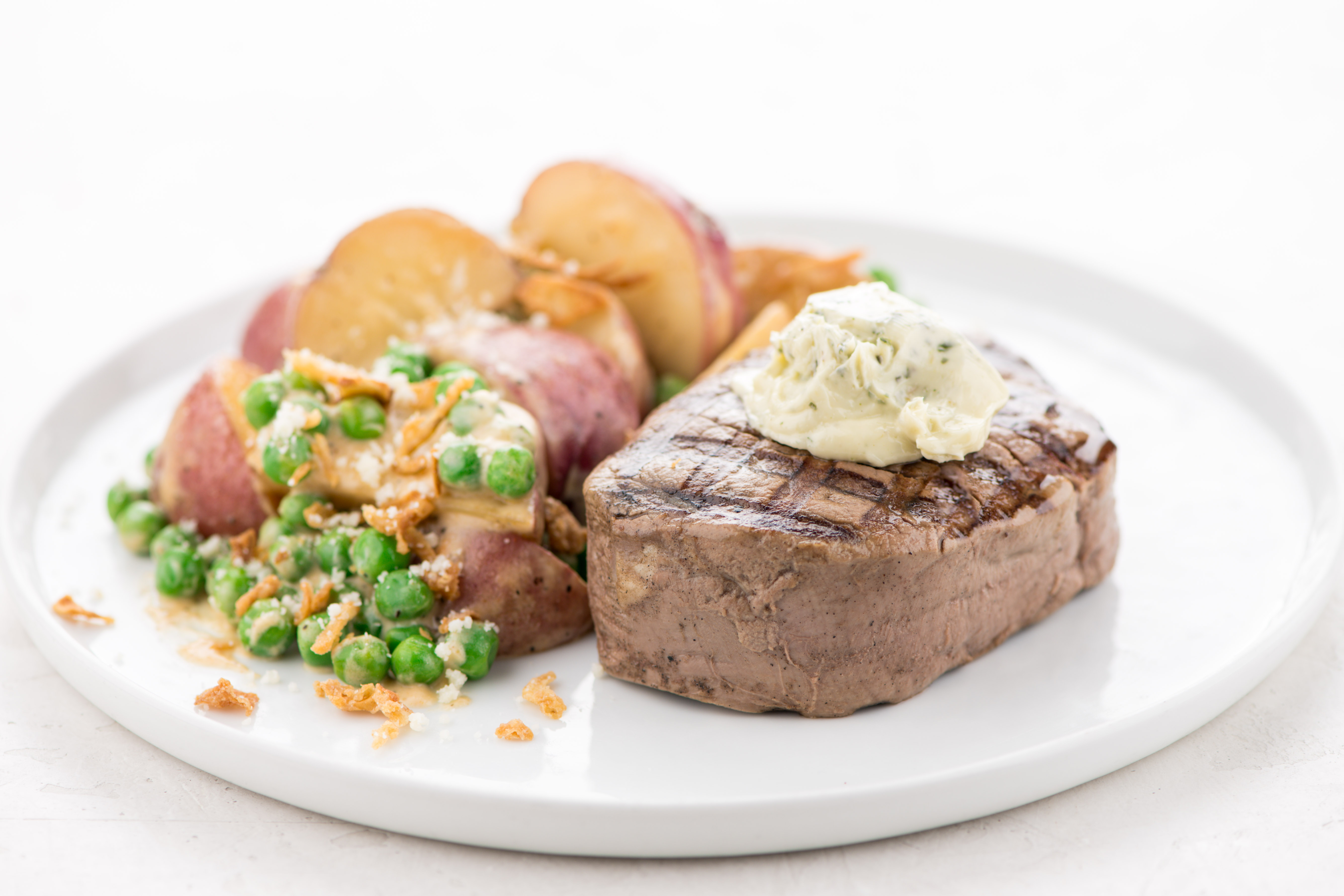 Tuscan Herb Steak with Parmesan Red Potatoes and Peas Recipe - Home Chef